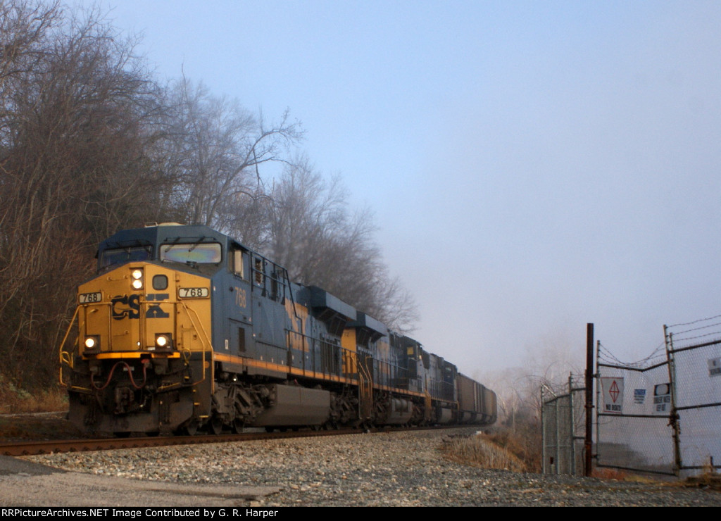 566 - CSXT 768 EB at the dam crossing in lifting fog